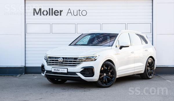 White Volkswagen Touareg 2019 in Riga, with an engine capacity of 4.00 L and mileage of 159 thousand km for 39950 €, photo 1 on AUTOMOTO.COM.LV