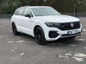 White Volkswagen Touareg 2019 in Riga, with an engine capacity of 3.00 L and mileage of 204 thousand km for 34900 €, photo 23 on AUTOMOTO.COM.LV