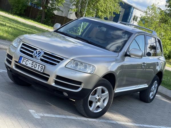 Yellow Volkswagen Touareg 2005 in Riga, with an engine capacity of 2.50 L and mileage of 260 thousand km for 2850 €, photo 1 on AUTOMOTO.COM.LV