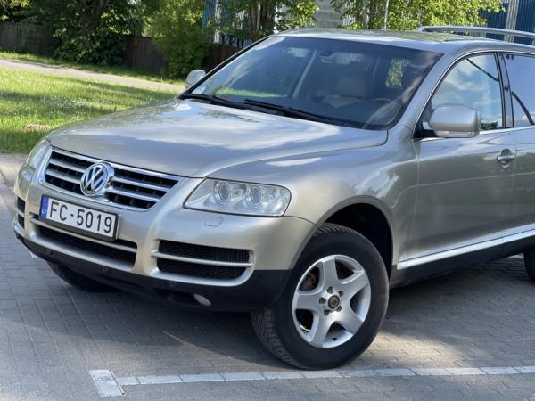 Yellow Volkswagen Touareg 2005 in Riga, with an engine capacity of 2.50 L and mileage of 260 thousand km for 2850 €, photo 9 on AUTOMOTO.COM.LV