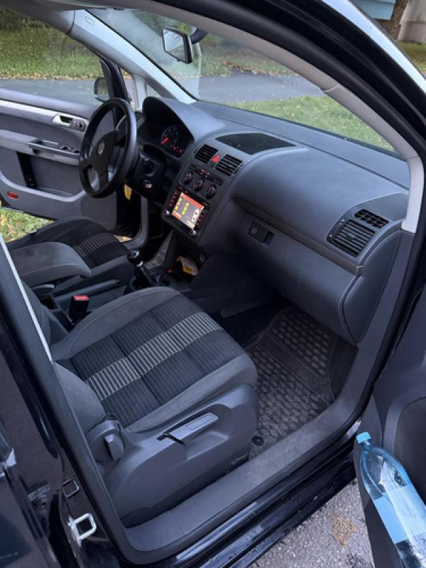 Black Volkswagen Touran 2009 in Tallinn, with an engine capacity of 1.90 L and mileage of 280 thousand km for 2000 €, photo 3 on AUTOMOTO.COM.LV