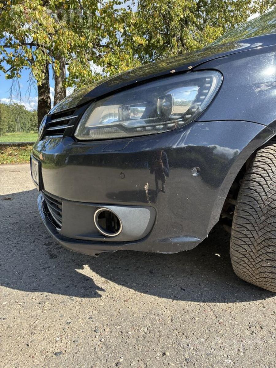 Melns Volkswagen Touran 2011 Madona, ar dzinēja tilpumu 2.00 L un nobraukumu 462 tūkst. km par 3500 €, foto 12 vietnē AUTOMOTO.COM.LV