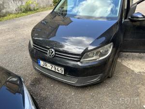 Black Volkswagen Touran 2011 in Riga, with an engine capacity of 2.00 L and mileage of 253 thousand km for 5500 €, photo  on AUTOMOTO.COM.LV