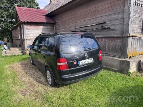 Melns Volkswagen Touran 2003 Rīga, ar dzinēja tilpumu 1.90 L un nobraukumu 336 tūkst. km par 1400 €, foto 5 vietnē AUTOMOTO.COM.LV