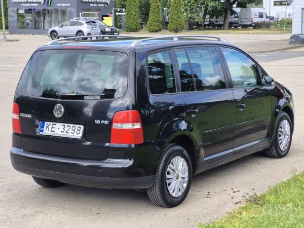 Melns Volkswagen Touran 2004 Rīga, ar dzinēja tilpumu 1.60 L un nobraukumu 290 tūkst. km par 2200 €, foto 4 vietnē AUTOMOTO.COM.LV