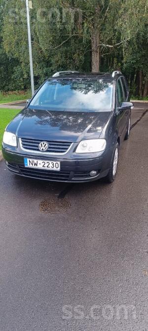 Black Volkswagen Touran 2005 in Riga, with an engine capacity of 2.00 L and mileage of 259 thousand km for 2150 €, photo  on AUTOMOTO.COM.LV