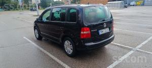 Black Volkswagen Touran 2005 in Riga, with an engine capacity of 2.00 L and mileage of 259 thousand km for 2150 €, photo 5 on AUTOMOTO.COM.LV