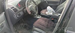 Black Volkswagen Touran 2005 in Riga, with an engine capacity of 2.00 L and mileage of 259 thousand km for 2150 €, photo 7 on AUTOMOTO.COM.LV