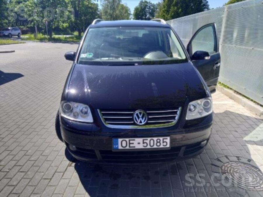 Black Volkswagen Touran 2006 in Riga, with an engine capacity of 2.00 L and mileage of 298 thousand km for 1150 €, photo 1 on AUTOMOTO.COM.LV