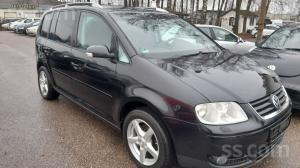 Black Volkswagen Touran 2006 in Riga, with an engine capacity of 1.90 L and mileage of 228 thousand km for 4100 €, photo 3 on AUTOMOTO.COM.LV