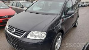 Black Volkswagen Touran 2006 in Riga, with an engine capacity of 1.90 L and mileage of 228 thousand km for 4100 €, photo 4 on AUTOMOTO.COM.LV