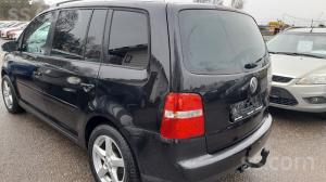 Black Volkswagen Touran 2006 in Riga, with an engine capacity of 1.90 L and mileage of 228 thousand km for 4100 €, photo 5 on AUTOMOTO.COM.LV