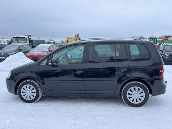 Black Volkswagen Touran 2006 in Siauliai, with an engine capacity of 1.97 L and mileage of 196 thousand km for 2550 €, photo 8 on AUTOMOTO.COM.LV