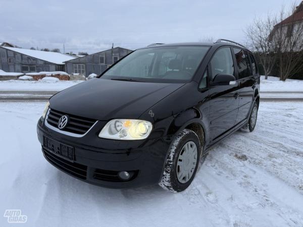 Black Volkswagen Touran 2006 in Alytus, with an engine capacity of 2.00 L and mileage of 256 thousand km for 2450 €, photo 1 on AUTOMOTO.COM.LV