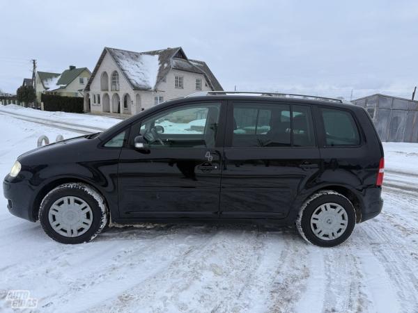 Black Volkswagen Touran 2006 in Alytus, with an engine capacity of 2.00 L and mileage of 256 thousand km for 2450 €, photo 5 on AUTOMOTO.COM.LV