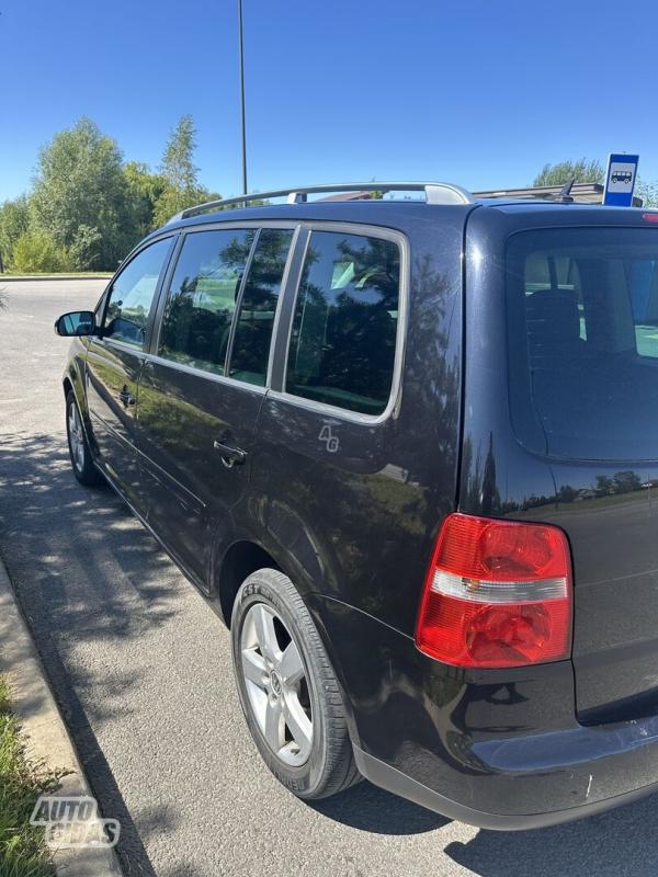 Black Volkswagen Touran 2006 in Kaunas, with an engine capacity of 2.00 L and mileage of 296 thousand km for 1550 €, photo 7 on AUTOMOTO.COM.LV