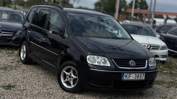 Black Volkswagen Touran 2006 in Jelgava, with an engine capacity of 2.00 L and mileage of 300 thousand km for 2290 €, photo 1 on AUTOMOTO.COM.LV