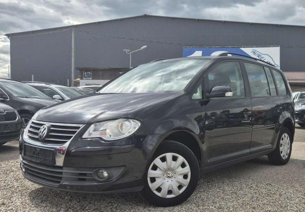 Black Volkswagen Touran 2006 in Kaunas, with an engine capacity of 1.90 L and mileage of 160 thousand km for 3250 €, photo 1 on AUTOMOTO.COM.LV