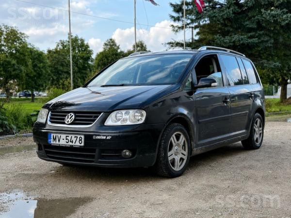 Black Volkswagen Touran 2006 in Riga, with an engine capacity of 2.00 L and mileage of 434 thousand km for 1390 €, photo 1 on AUTOMOTO.COM.LV