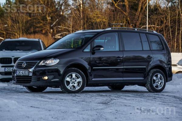 Black Volkswagen Touran 2007 in Riga, with an engine capacity of 1.40 L and mileage of 238 thousand km for 3990 €, photo 1 on AUTOMOTO.COM.LV