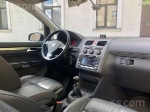 Melns Volkswagen Touran 2007 Rīga, ar dzinēja tilpumu 1.40 L un nobraukumu 242 tūkst. km par 3950 €, foto 12 vietnē AUTOMOTO.COM.LV