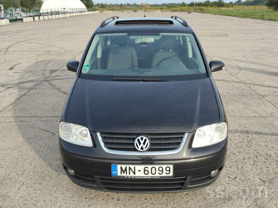 Black Volkswagen Touran 2007 in Riga, with an engine capacity of 2.00 L and mileage of 286 thousand km for 1988 €, photo 1 on AUTOMOTO.COM.LV