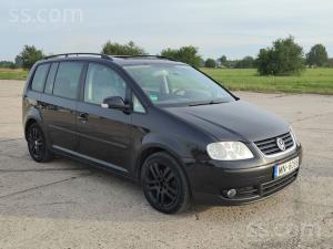 Black Volkswagen Touran 2007 in Riga, with an engine capacity of 2.00 L and mileage of 286 thousand km for 1988 €, photo 6 on AUTOMOTO.COM.LV