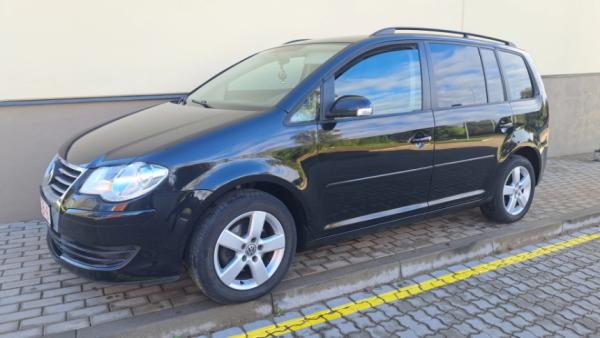 Black Volkswagen Touran 2008 in Riga, with an engine capacity of 2.00 L and mileage of 312 thousand km for 3950 €, photo 1 on AUTOMOTO.COM.LV