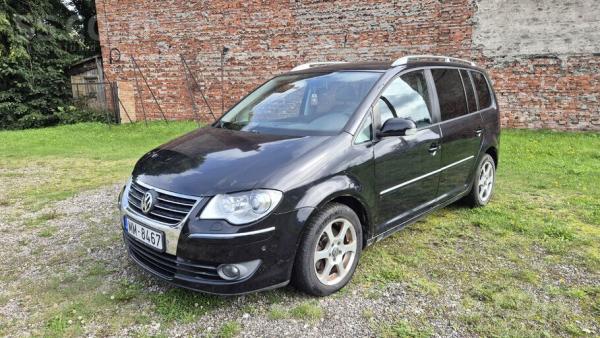 Melns Volkswagen Touran 2008 Liepāja, ar dzinēja tilpumu 1.40 L un nobraukumu 210 tūkst. km par 1450 €, foto 1 vietnē AUTOMOTO.COM.LV