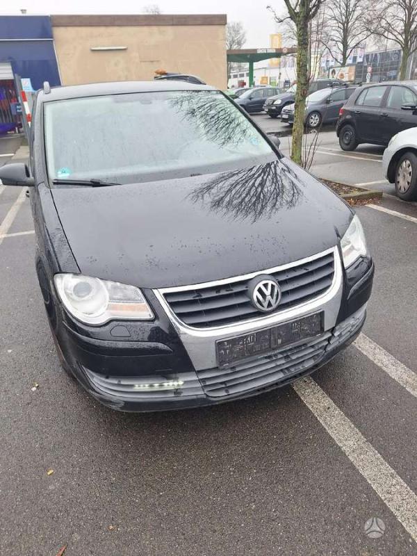 Black Volkswagen Touran 2009 in Jurbarkas, with an engine capacity of 1.90 L and mileage of 262 thousand km for 3199 €, photo 1 on AUTOMOTO.COM.LV