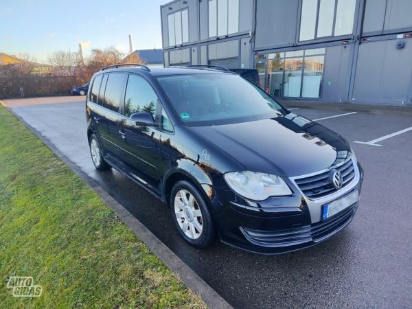 Black Volkswagen Touran 2009 in Vilnius, with an engine capacity of 2.00 L and mileage of 302 thousand km for 1700 €, photo 1 on AUTOMOTO.COM.LV