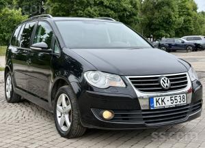 Black Volkswagen Touran 2009 in Riga, with an engine capacity of 2.00 L and mileage of 341 thousand km for 2300 €, photo  on AUTOMOTO.COM.LV