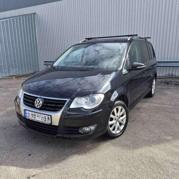 Black Volkswagen Touran 2009 in Kaunas, with an engine capacity of 1.39 L and mileage of 236 thousand km for 1900 €, photo 1 on AUTOMOTO.COM.LV