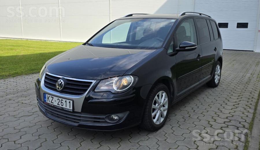 Black Volkswagen Touran 2009 in Riga, with an engine capacity of 1.40 L and mileage of 230 thousand km for 3850 €, photo 1 on AUTOMOTO.COM.LV