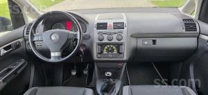 Black Volkswagen Touran 2009 in Riga, with an engine capacity of 1.40 L and mileage of 230 thousand km for 3850 €, photo 14 on AUTOMOTO.COM.LV
