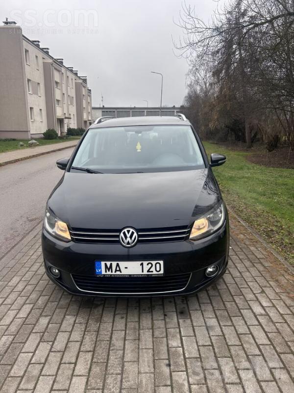 Black Volkswagen Touran 2010 in Riga, with an engine capacity of 2.00 L and mileage of 310 thousand km for 4000 €, photo 1 on AUTOMOTO.COM.LV