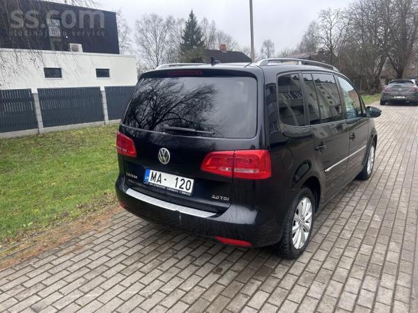 Black Volkswagen Touran 2010 in Riga, with an engine capacity of 2.00 L and mileage of 310 thousand km for 4000 €, photo 4 on AUTOMOTO.COM.LV