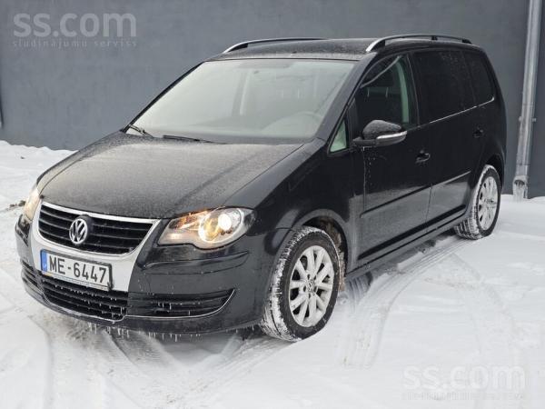 Black Volkswagen Touran 2010 in Ogre, with an engine capacity of 1.90 L and mileage of 233 thousand km for 3999 €, photo 2 on AUTOMOTO.COM.LV