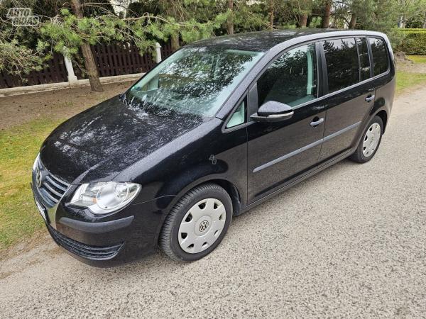 Black Volkswagen Touran 2010 in Mazeikiai, with an engine capacity of 1.90 L and mileage of 249 thousand km for 3950 €, photo 1 on AUTOMOTO.COM.LV