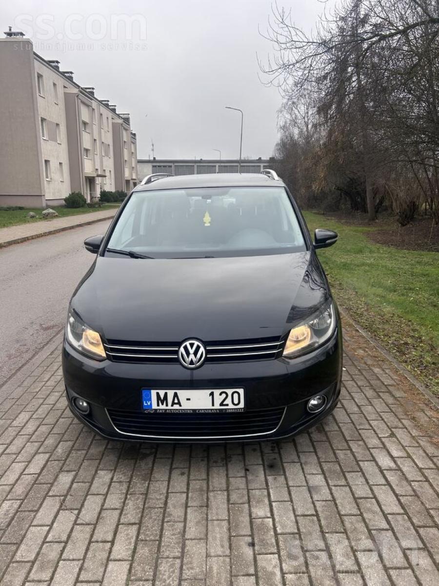 Black Volkswagen Touran 2010 in Riga, with an engine capacity of 2.00 L and mileage of 310 thousand km for 3500 €, photo 1 on AUTOMOTO.COM.LV