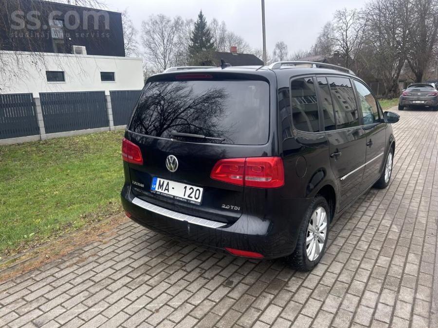 Black Volkswagen Touran 2010 in Riga, with an engine capacity of 2.00 L and mileage of 310 thousand km for 3500 €, photo 5 on AUTOMOTO.COM.LV