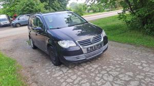 Black Volkswagen Touran 2010 in Kedainiai, with an engine capacity of 1.90 L and mileage of 305 thousand km for 2999 €, photo  on AUTOMOTO.COM.LV