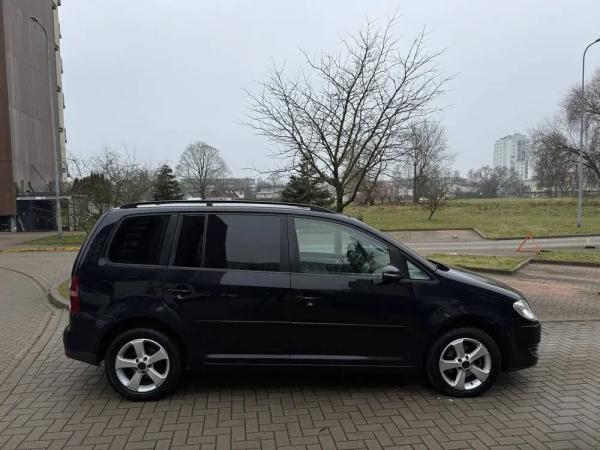 Black Volkswagen Touran 2010 in Riga, with an engine capacity of 2.00 L and mileage of 295 thousand km for 2790 €, photo 2 on AUTOMOTO.COM.LV
