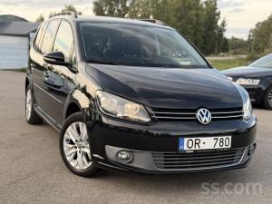 Melns Volkswagen Touran 2010 Ogre, ar dzinēja tilpumu 2.00 L un nobraukumu 192 tūkst. km par 7200 €, foto  vietnē AUTOMOTO.COM.LV