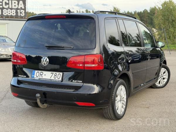 Black Volkswagen Touran 2010 in Ogre, with an engine capacity of 2.00 L and mileage of 192 thousand km for 7200 €, photo 5 on AUTOMOTO.COM.LV