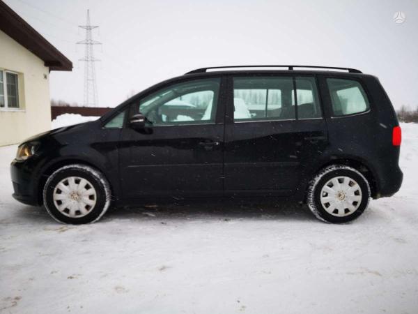 Black Volkswagen Touran 2011 in Klaipeda, with an engine capacity of 1.60 L and mileage of 244 thousand km for 4999 €, photo 4 on AUTOMOTO.COM.LV