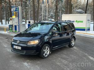 Black Volkswagen Touran 2011 in Riga, with an engine capacity of 1.40 L and mileage of 0 thousand km for 6499 €, photo  on AUTOMOTO.COM.LV