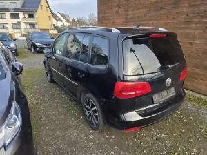 Black Volkswagen Touran 2011 in Marijampole, with an engine capacity of 1.97 L and mileage of 264 thousand km for 5700 €, photo 4 on AUTOMOTO.COM.LV