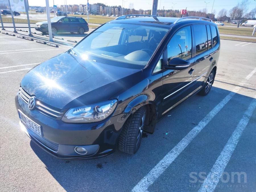Black Volkswagen Touran 2011 in Riga, with an engine capacity of 2.00 L and mileage of 293 thousand km for 5490 €, photo 1 on AUTOMOTO.COM.LV