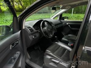 Melns Volkswagen Touran 2011 Rīga, ar dzinēja tilpumu 1.40 L un nobraukumu 0 tūkst. km par 4799 €, foto 10 vietnē AUTOMOTO.COM.LV